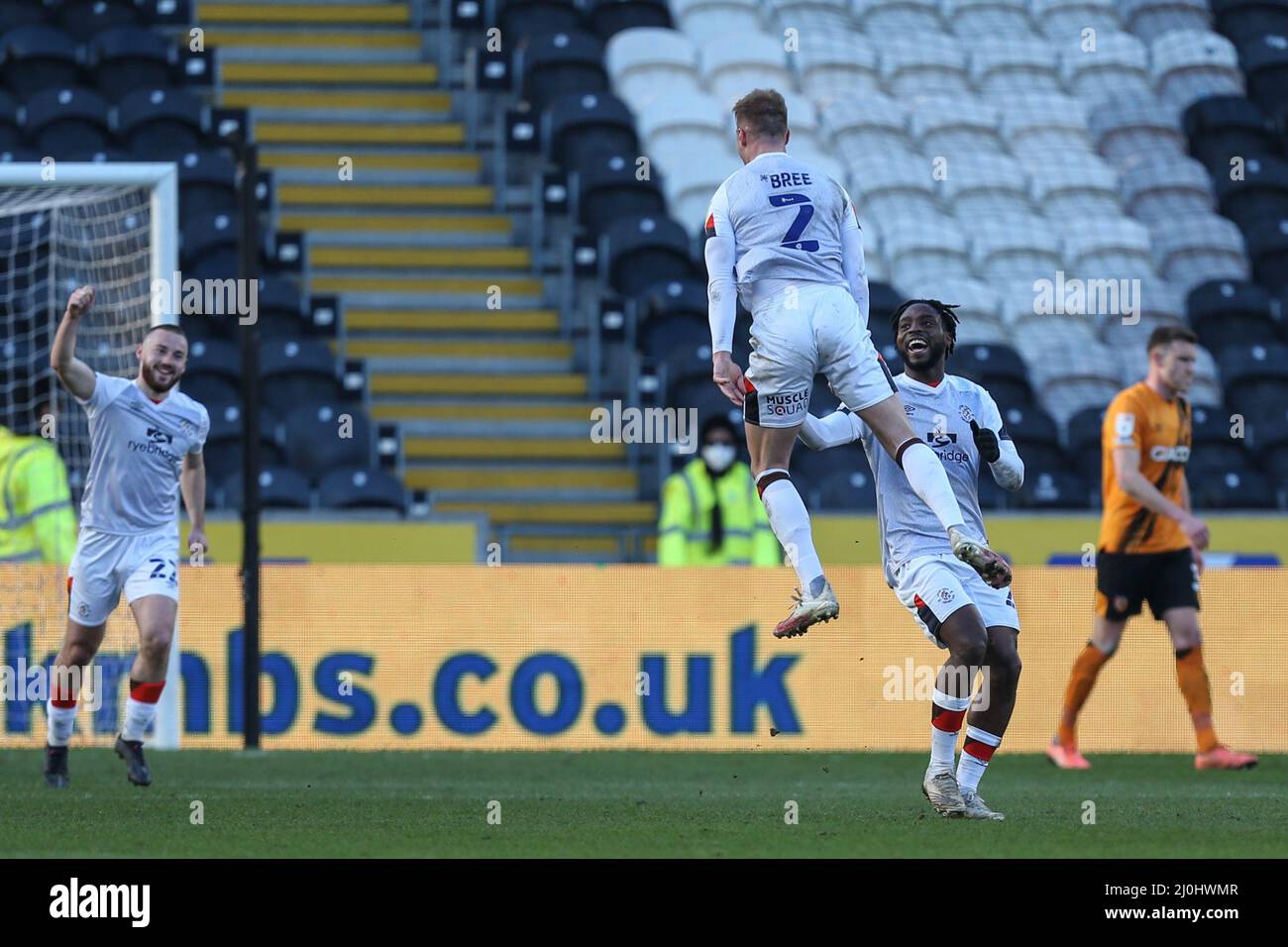 James Bree #2 of Luton Town jumps for joy after scoring a free kick to ...