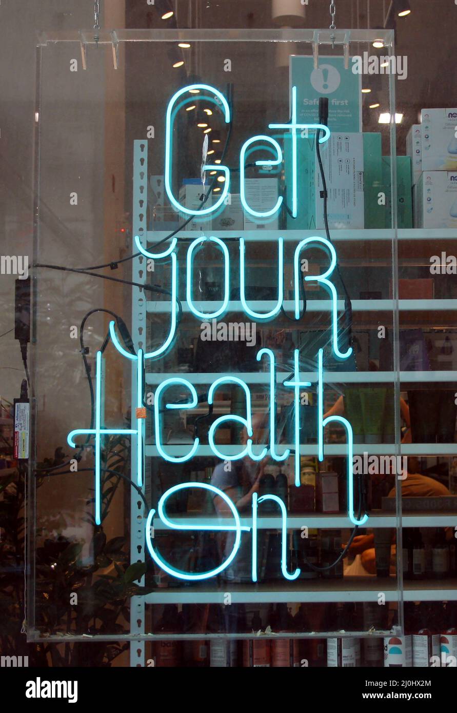 Closeup of a "Get your health on" neon sign in a store window Stock ...
