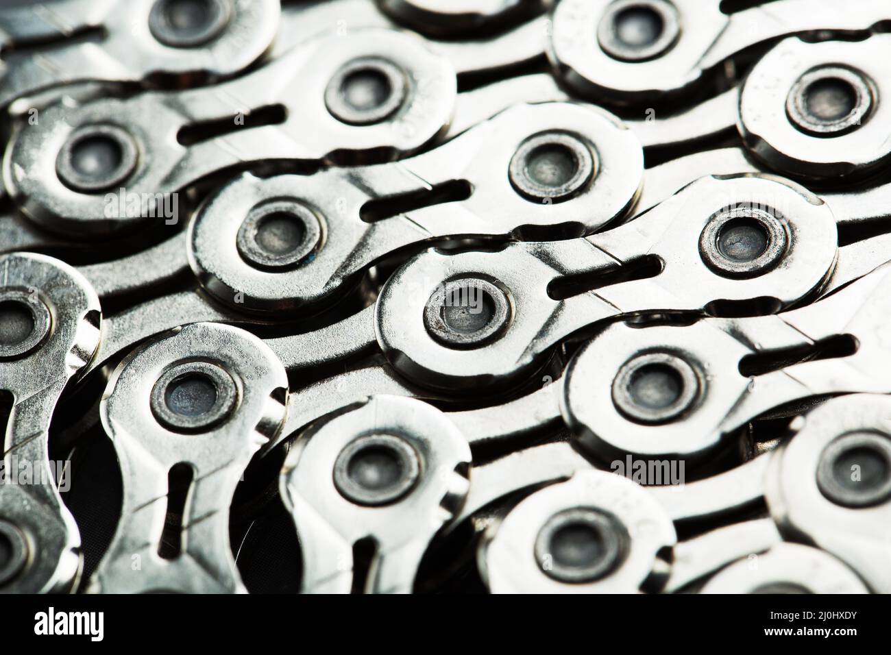 Patterns of a technological bicycle chain braided in a circle with blue ...