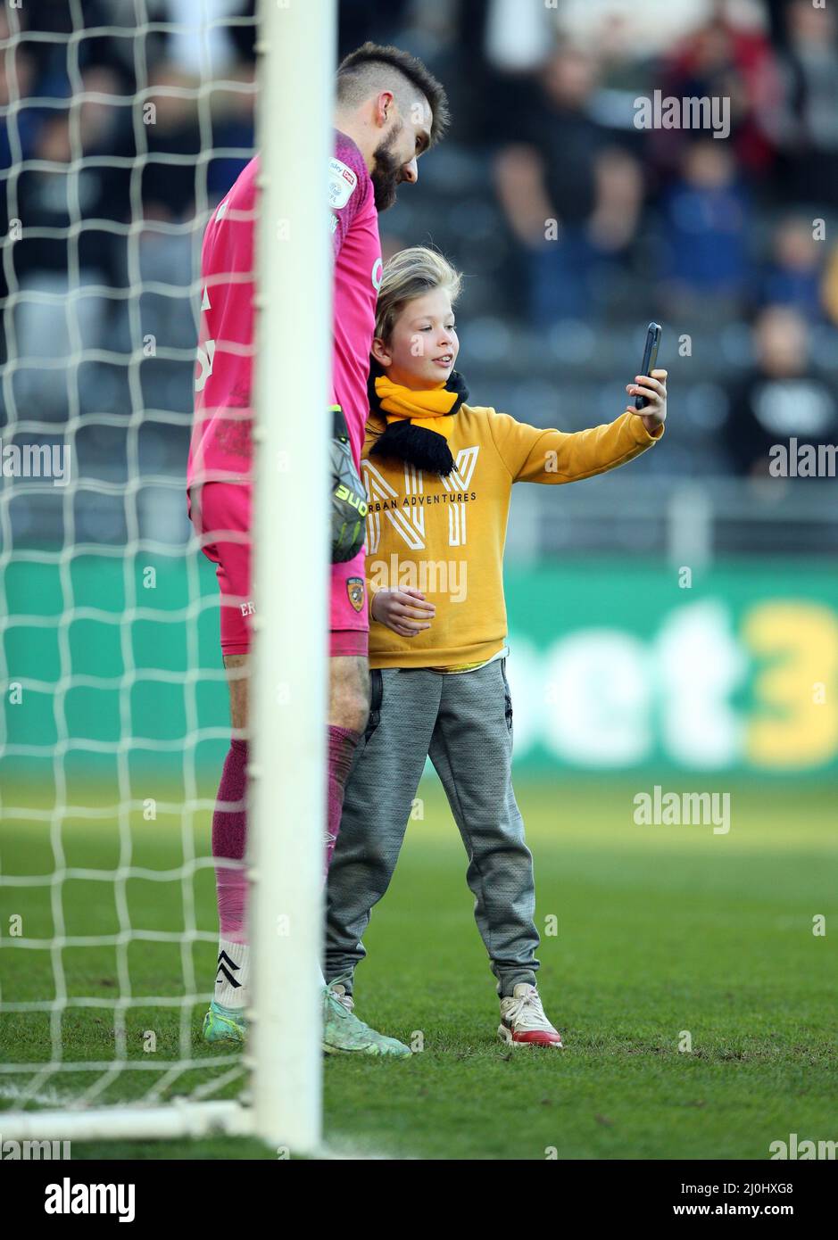 A pitch invader has a selfie with Hull City goalkeeper Matt Ingram ...