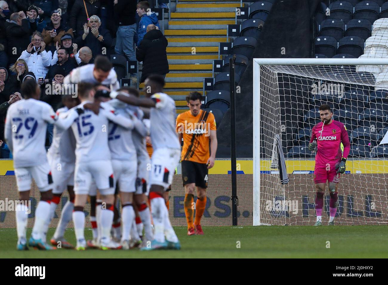 The Luton Town players celebrate their third goal as Matt Ingram #1 of ...