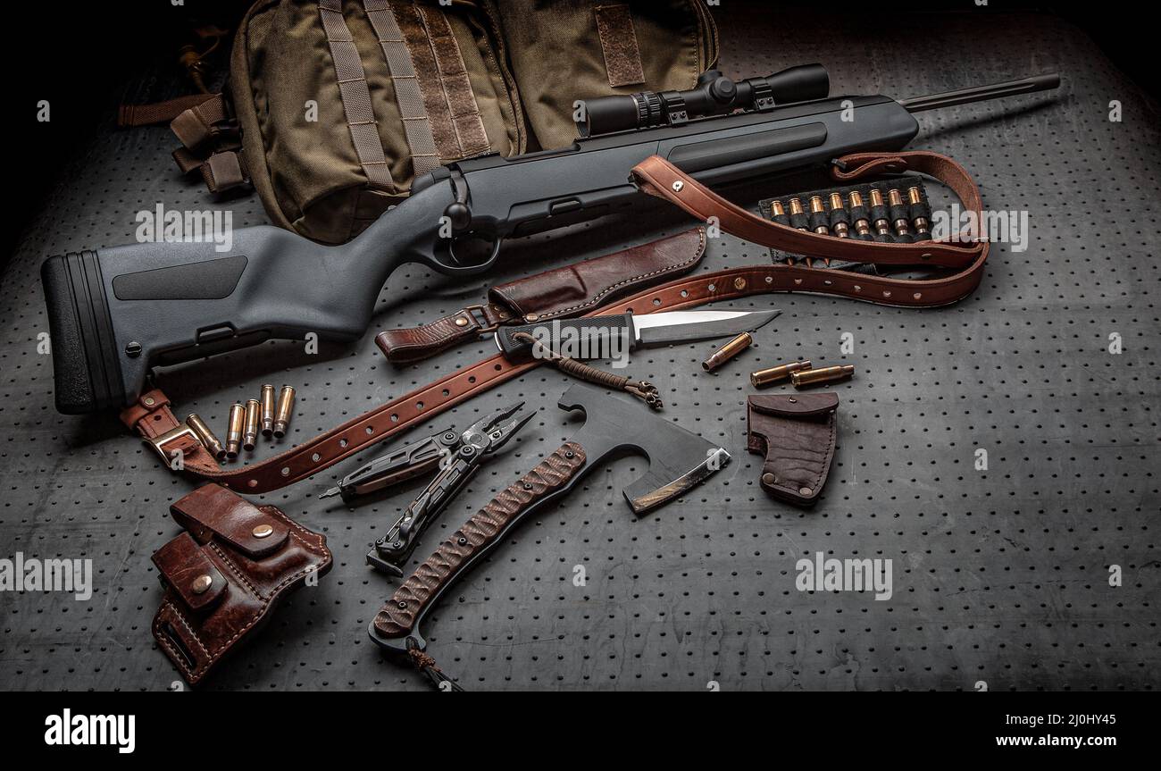 A modern bolt-action carbine with an optical sight. The scout rifle is ...