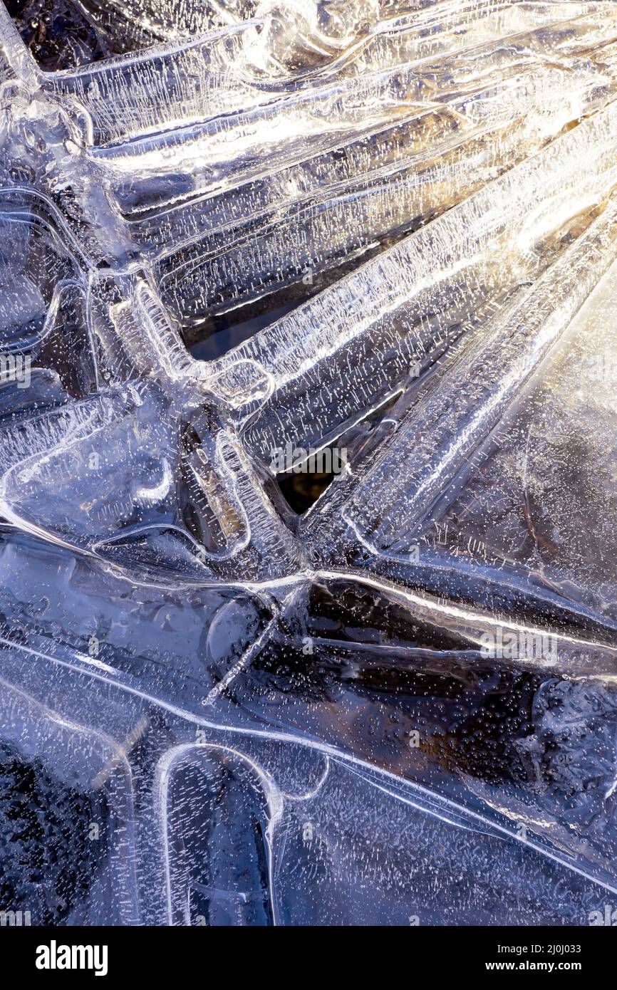 This is a macro photo of some colorful blue and purple ice. The frozen ...
