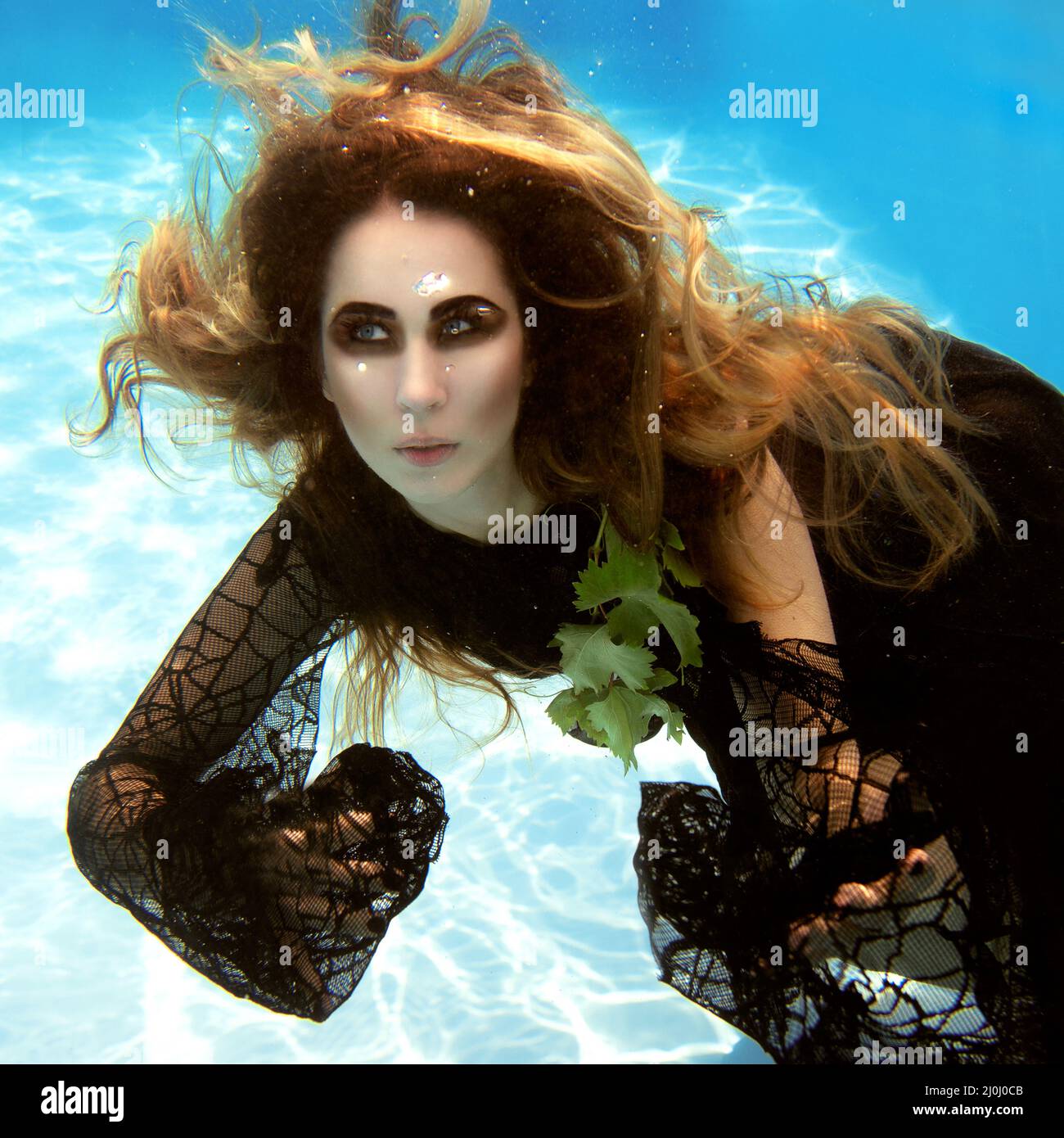 Woman in dress underwater hi-res stock photography and images - Alamy