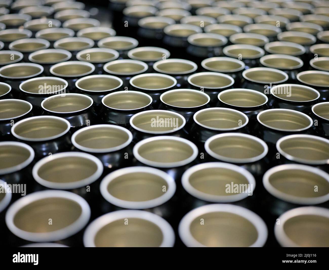 Set of open beer cans in a packaging factory Stock Photo - Alamy