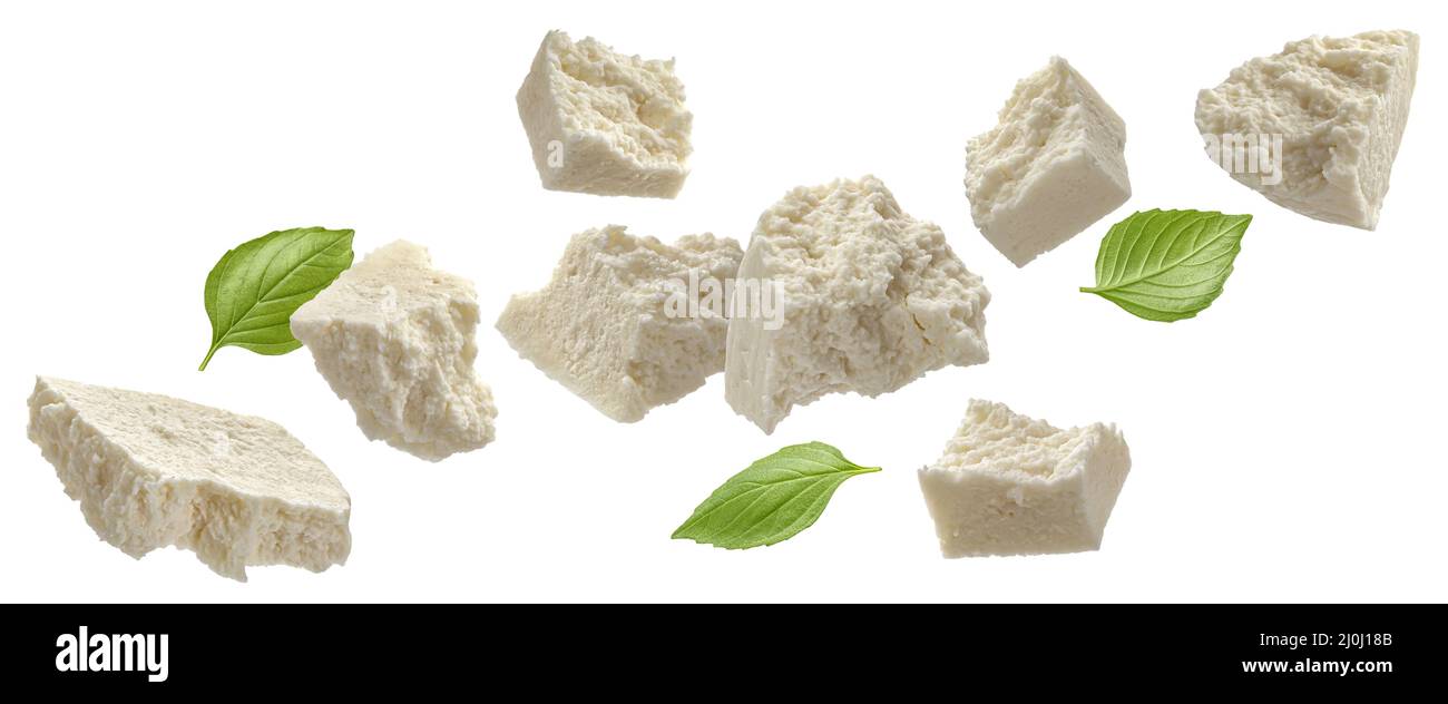 Sliced feta, diced curd cheese isolated on white background Stock Photo ...