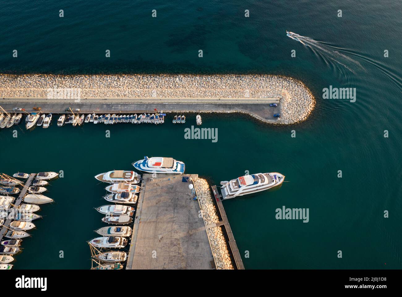 Aerial view of fishing boats and tourist yachts moored at the marina ...