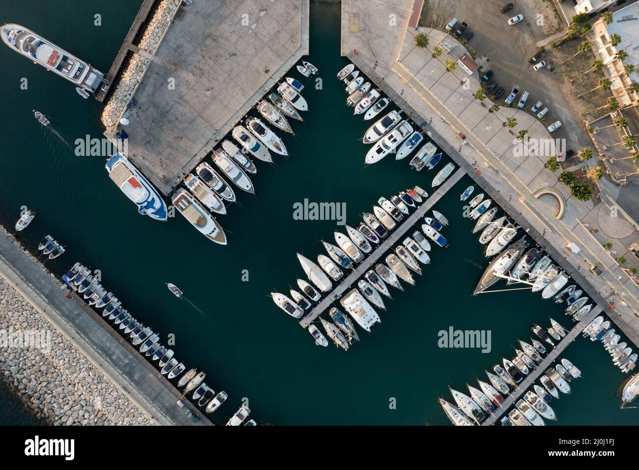 Aerial view of fishing boats and tourist yachts moored at the marina ...