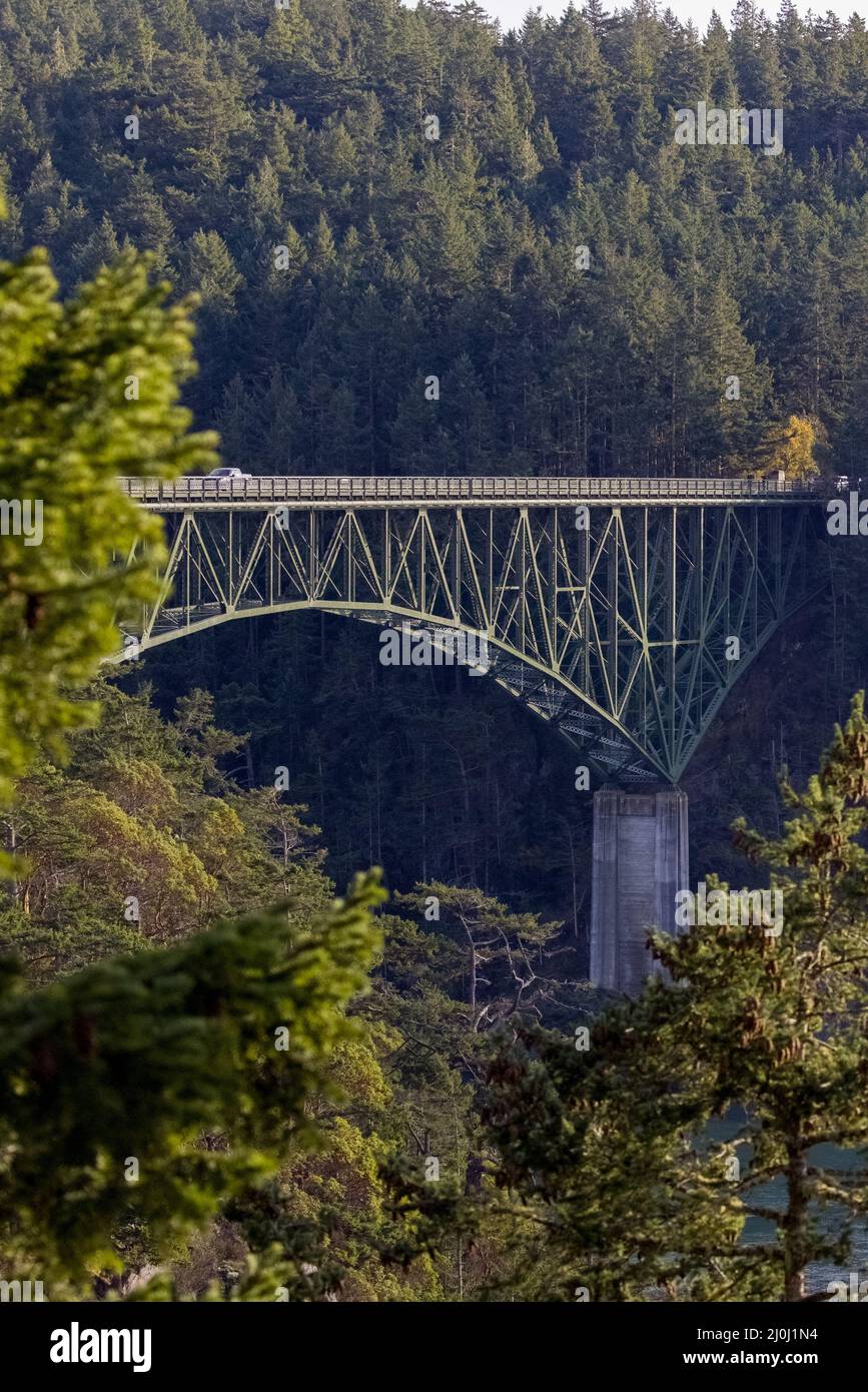 steel bridge over ocean inlet with forest cliffs Stock Photo - Alamy