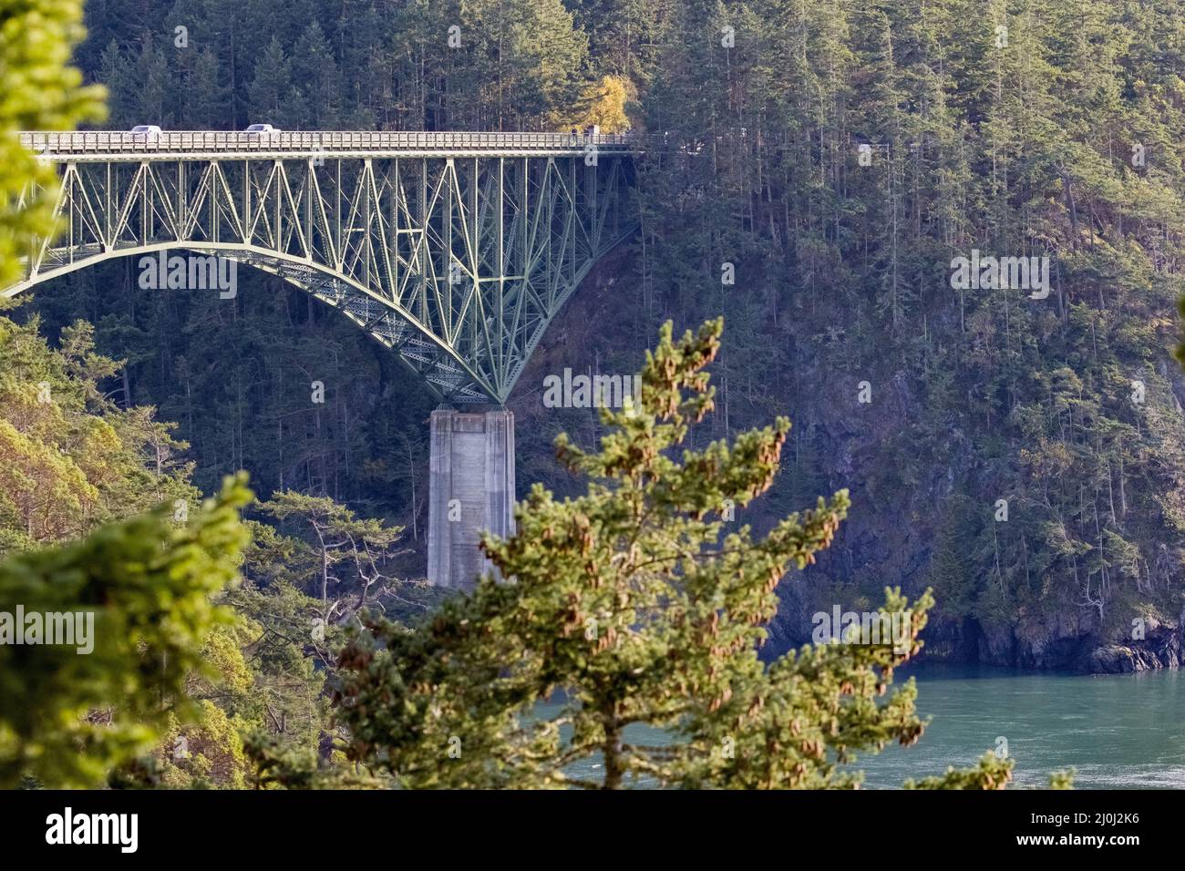 concrete and green steel bridge over ocean Stock Photo - Alamy