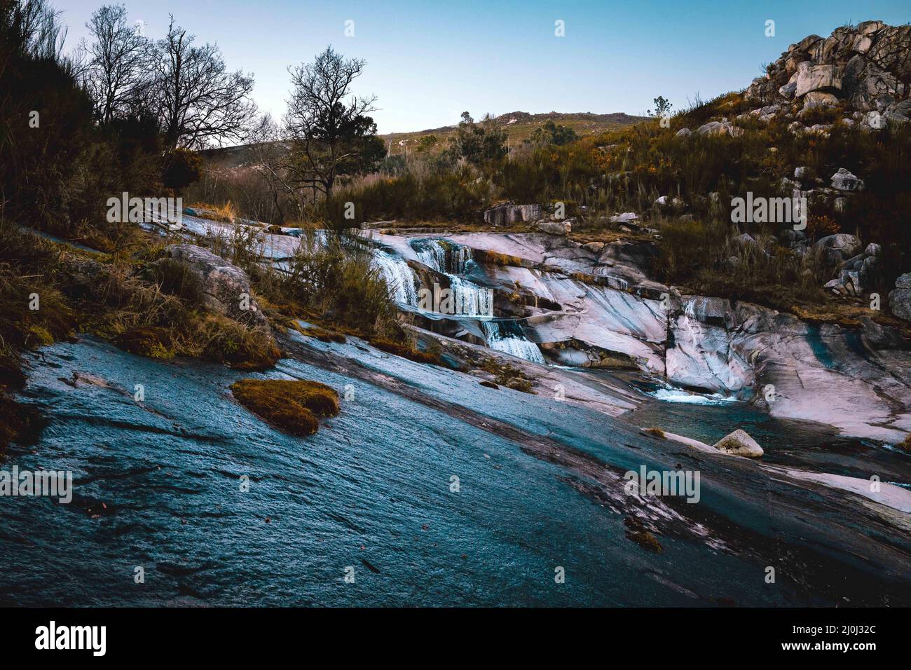 Multi-layered waterfalls flowing down granite stones Stock Photo - Alamy
