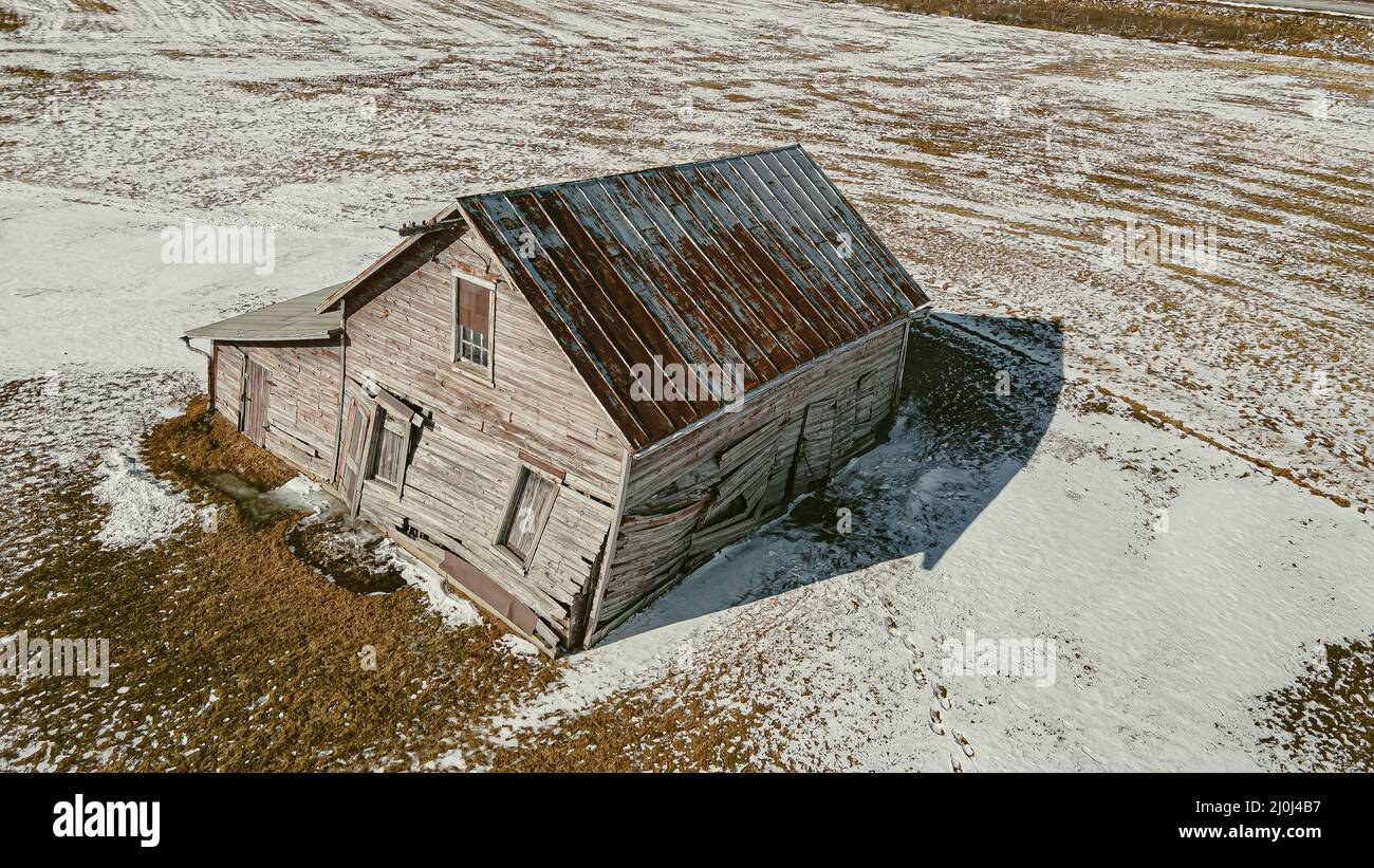 A building that collapses under its own weight as snow melts around it ...