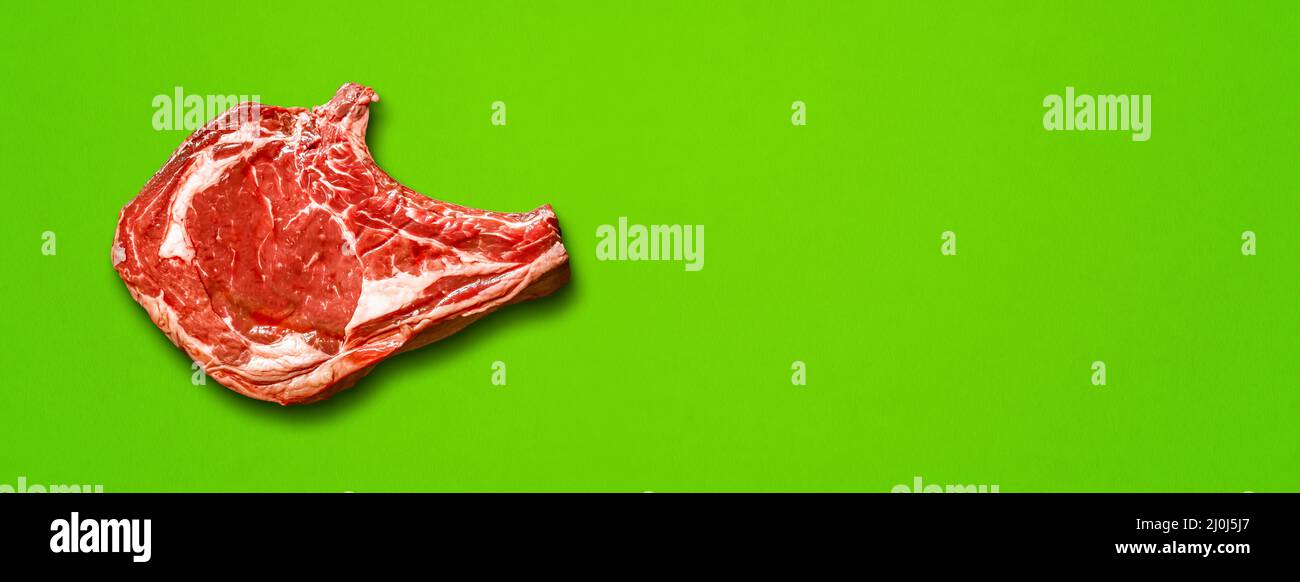 Beef prime rib isolated on green background. Horizontal banner Stock ...