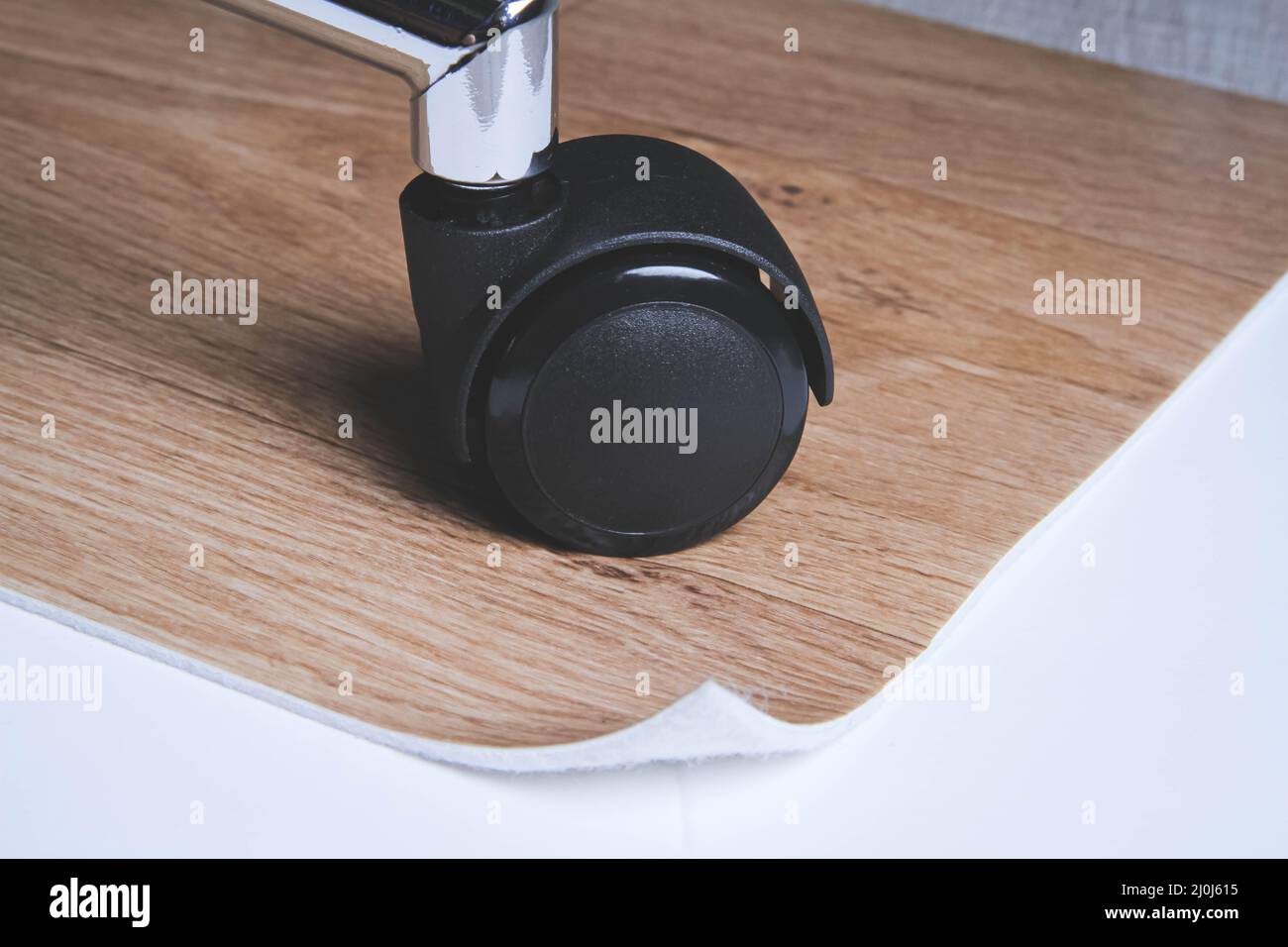 Linoleum in the office. Armchair on wheels on linoleum. Floor ...