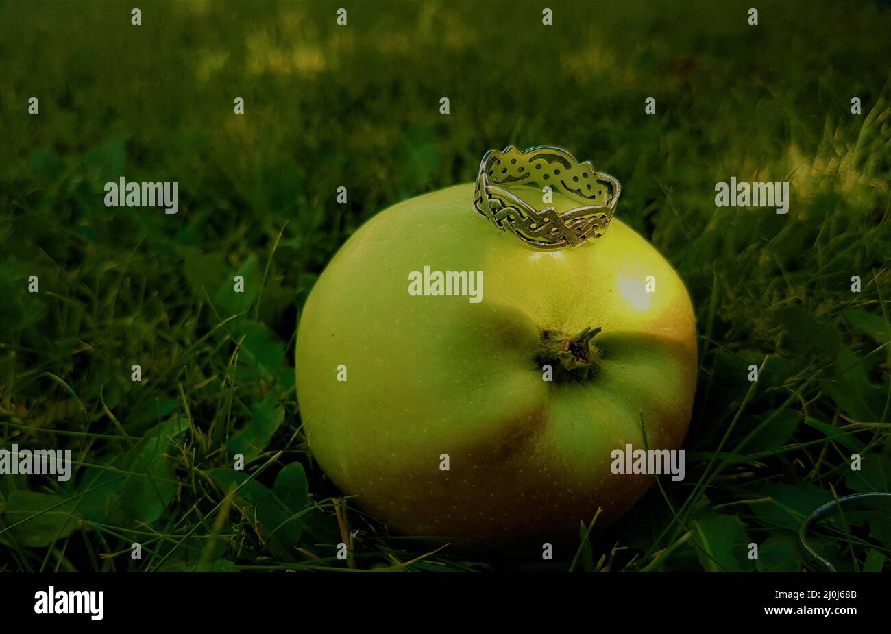 Apple with a ring on it Stock Photo - Alamy