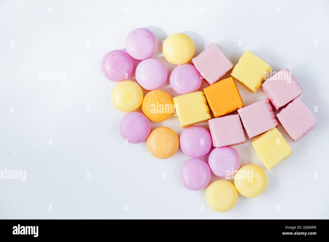 Sweet colorful confectionery, candy on the white background, high angle ...