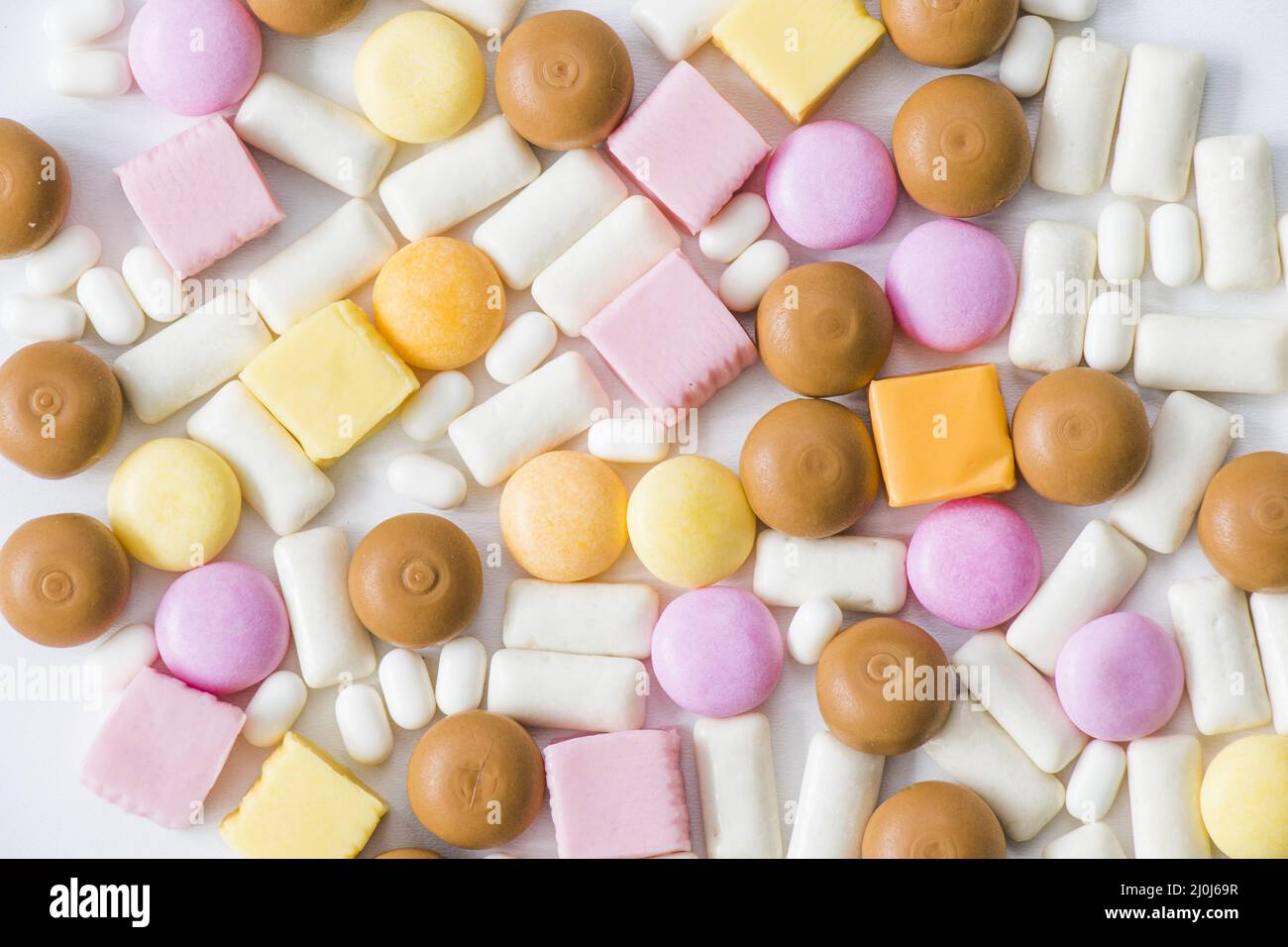 Sweet colorful confectionery, candy on the white background, high angle ...