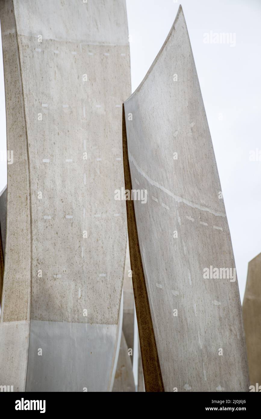 Vertical shot of a metallic sword architectural statue on the Omaha ...
