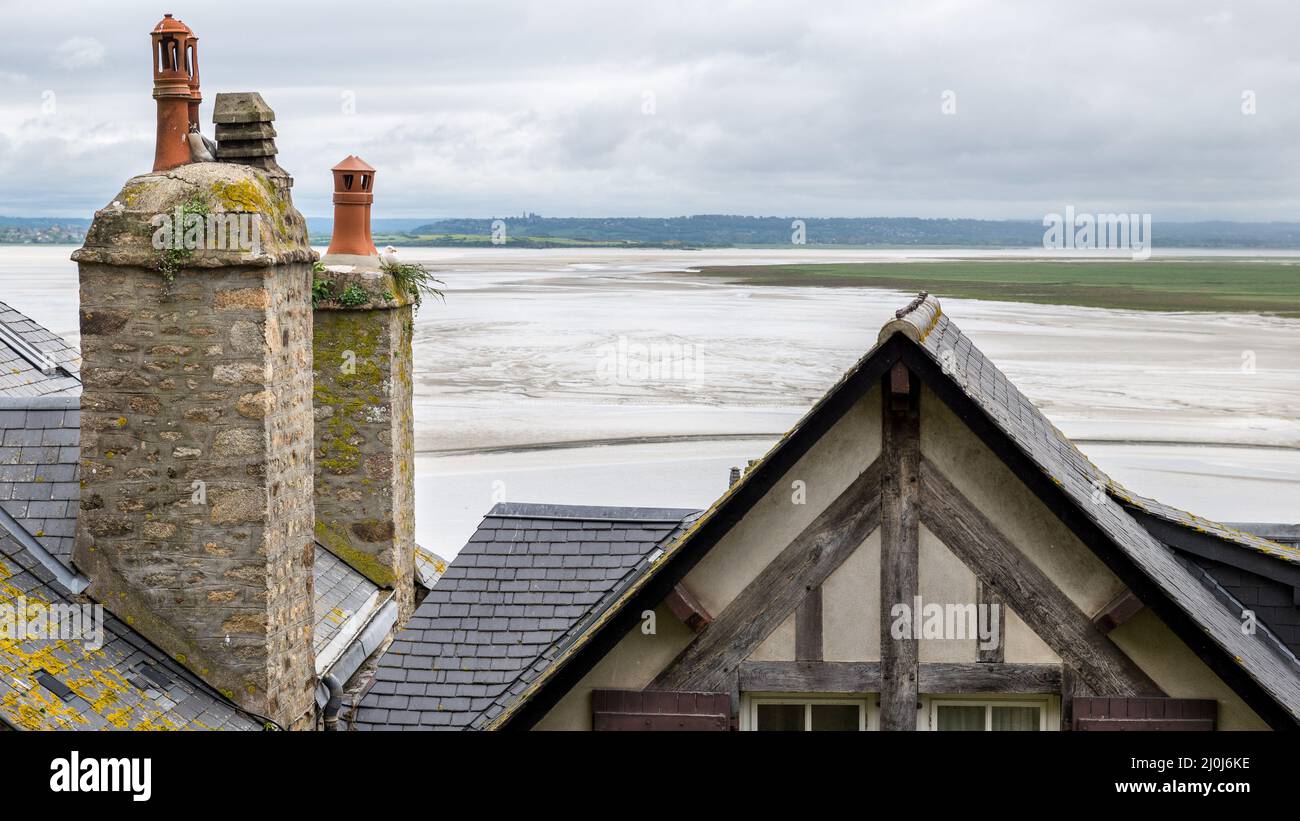 Beautiful shot of the back of buildings in Mont Saint-Michel background ...