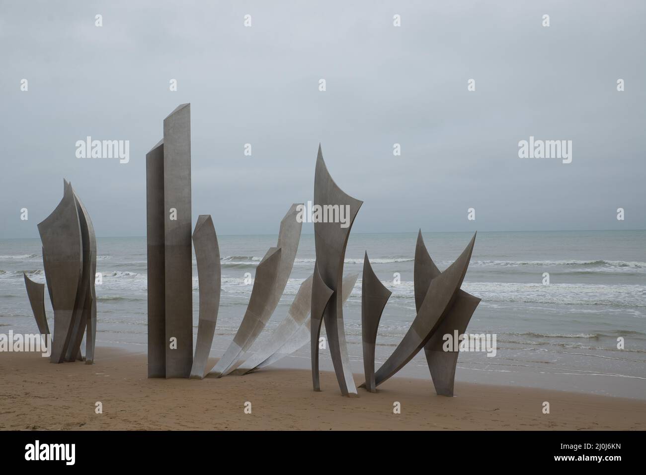 Metallic architectural sword statue on the Omaha beach Stock Photo - Alamy