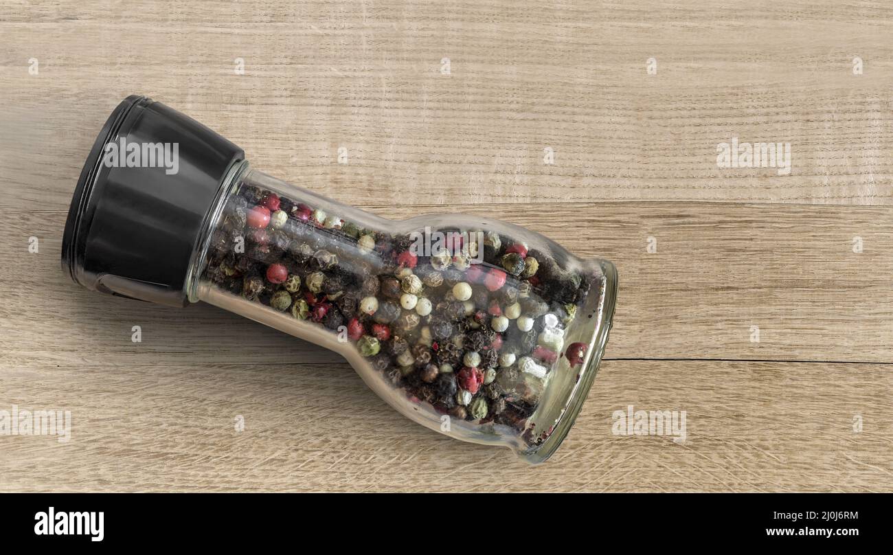 Various varieties of pepper in a glass bottle Stock Photo - Alamy
