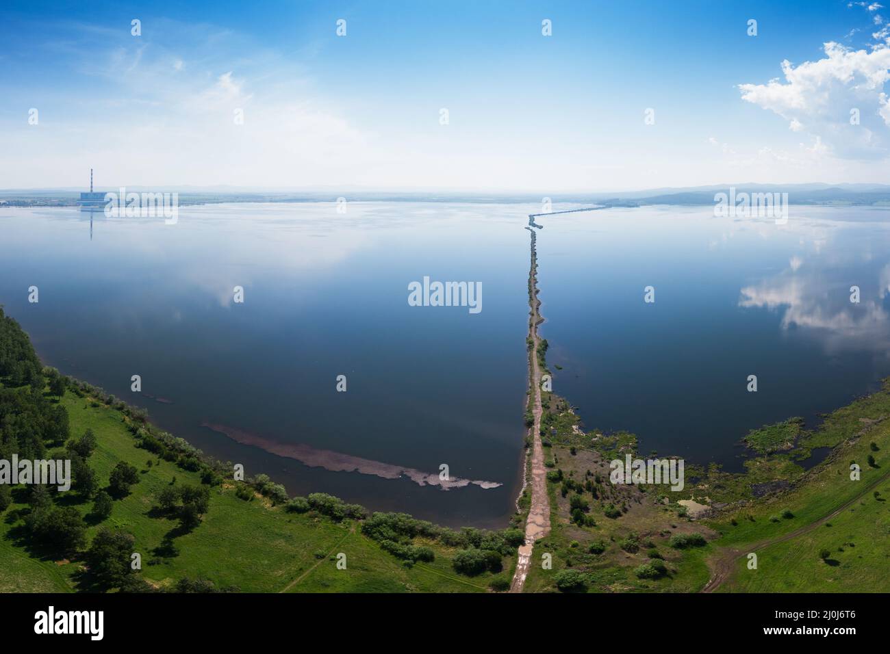 Aerial drone view of lake landscape with road Stock Photo - Alamy