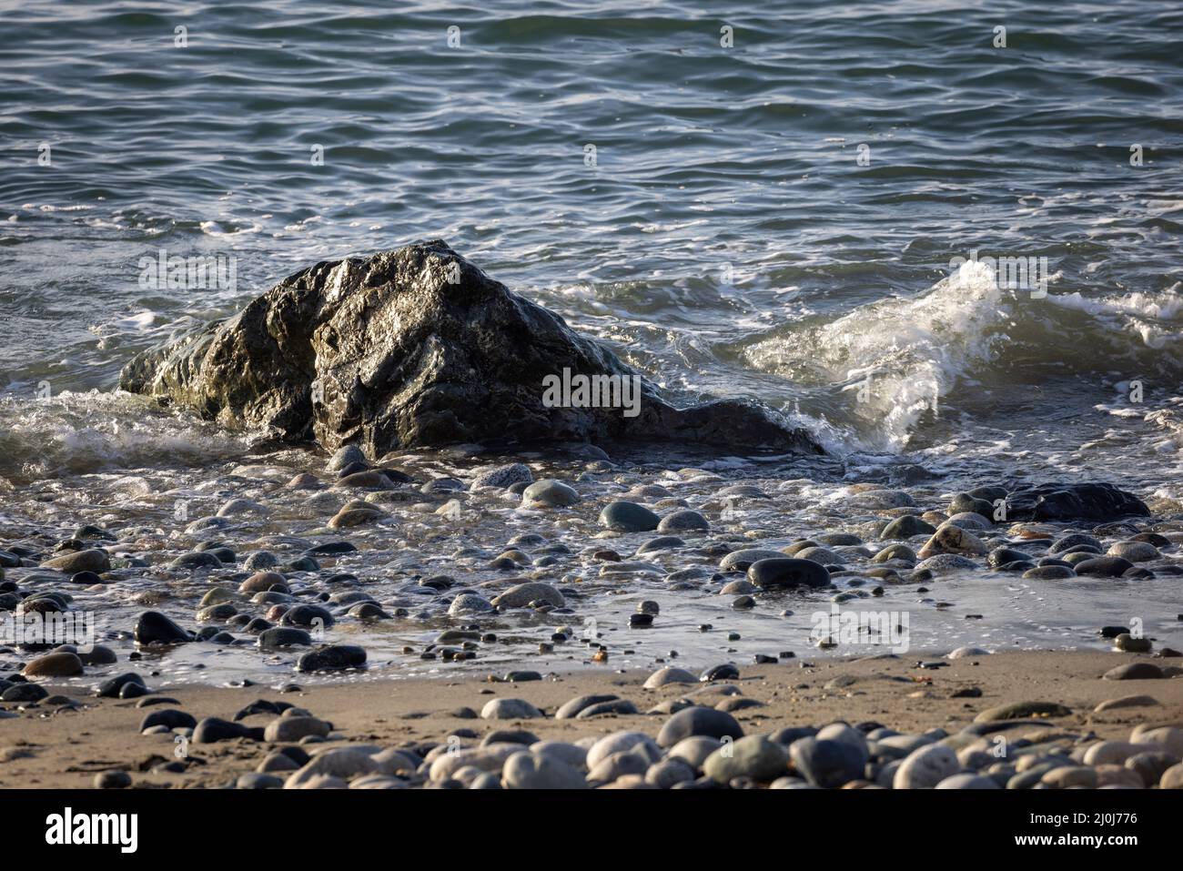 Small waves crash on shore hi-res stock photography and images - Alamy