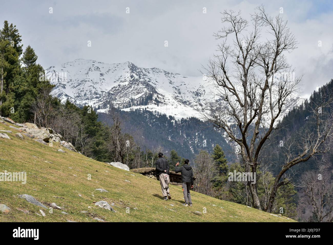Ganderbal, Kashmir, India. 19th Mar, 2022. Visitors walk up the hill on ...