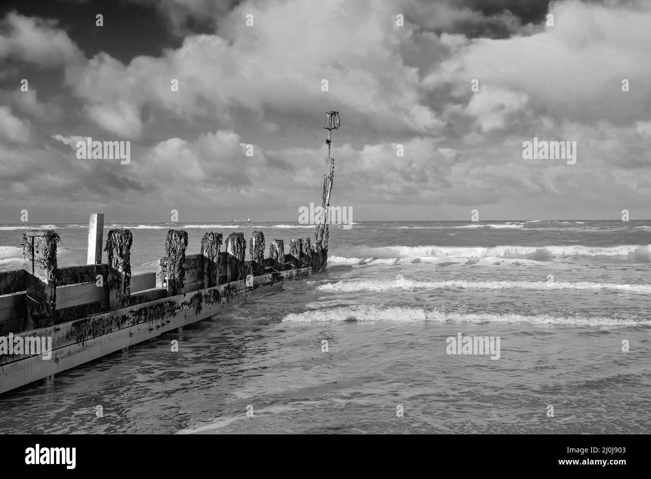 Black and white photo of wooden groynes and sea defences on Cromer ...