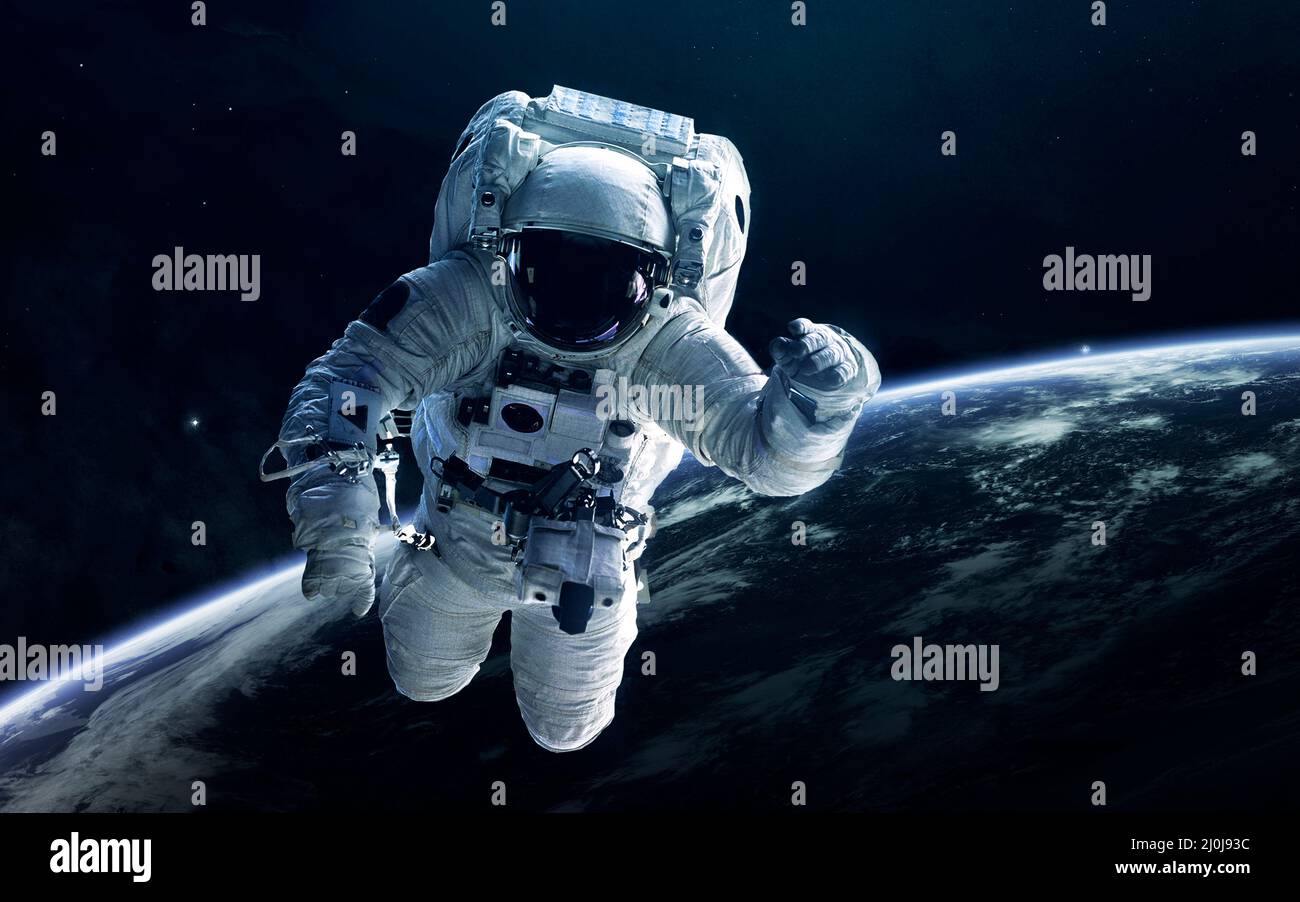 Astronaut in outer space. Elements of this image furnished by NASA ...