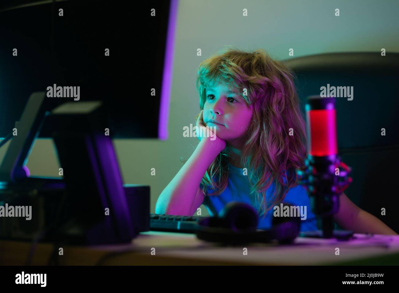 Little child blogger. Kid Boy recording a podcast on computer. Social ...