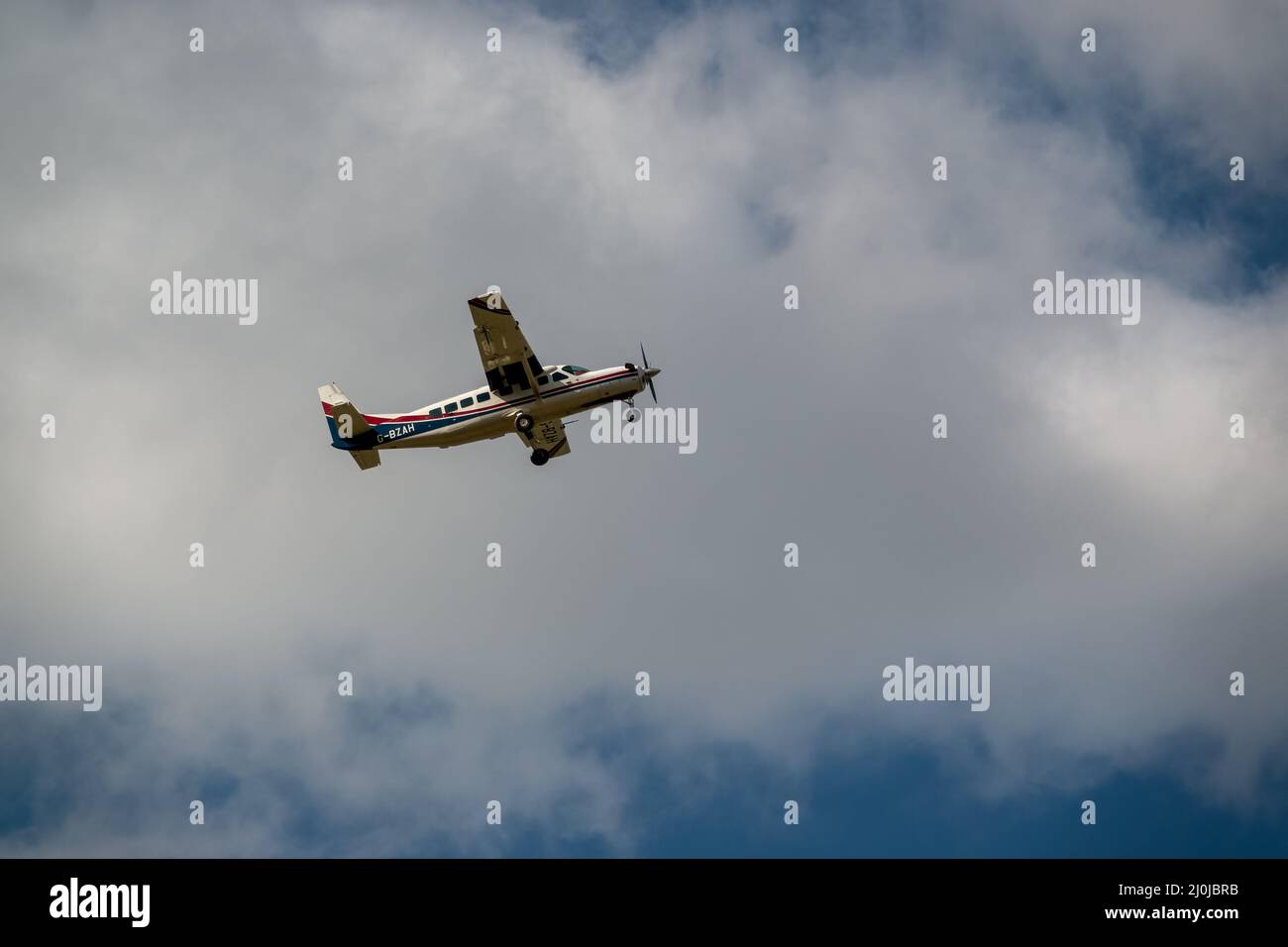 Cessna 208b Grand Caravan G-BZAH light aircraft ascending from take off ...