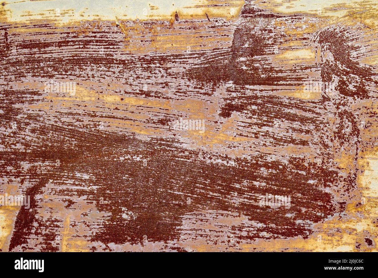 Red brown abstract background with pink and turquoise hues. A weathered ...