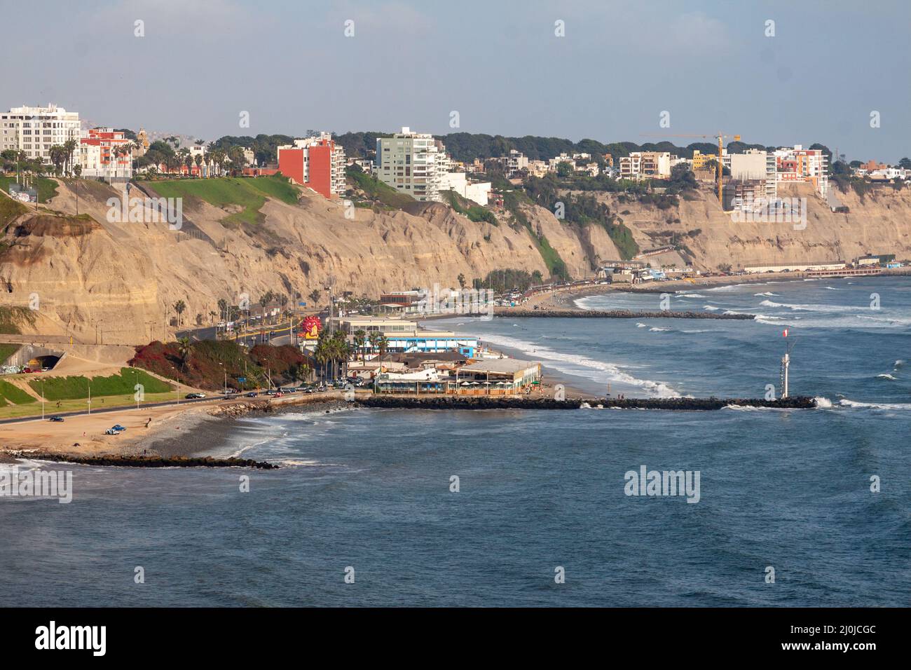 Aerial view of cliffs alongside the Miraflores beach in Lima, Peru ...
