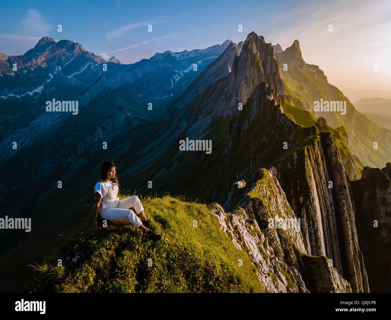 Woman hiking in the mountains, Schaefler Altenalptuerme mountain ridge ...