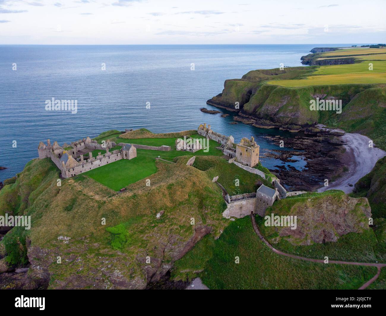 Aerial view of the Dunnottar Castle and surrounding valleys in Scotland ...