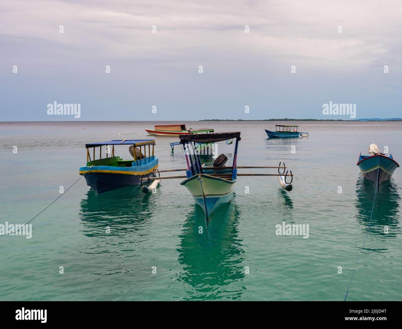Ora Beach, Indonesia - Feb, 2018: Boats on the tropical beach of Ora ...