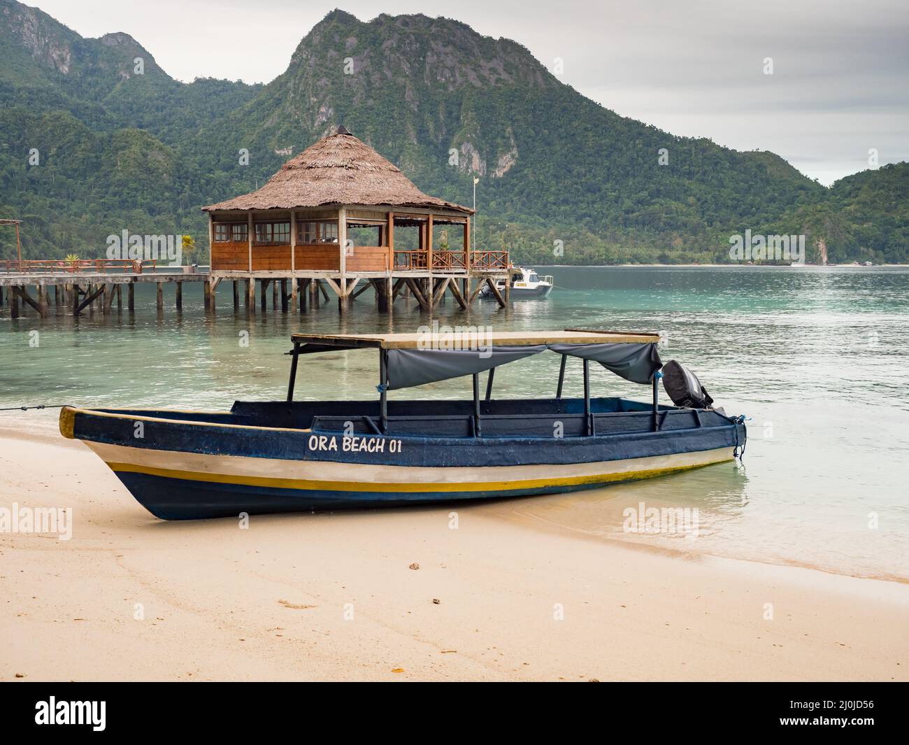 Ora Beach, Indonesia - Feb, 2018: Houses on the water in Ora Beach ...
