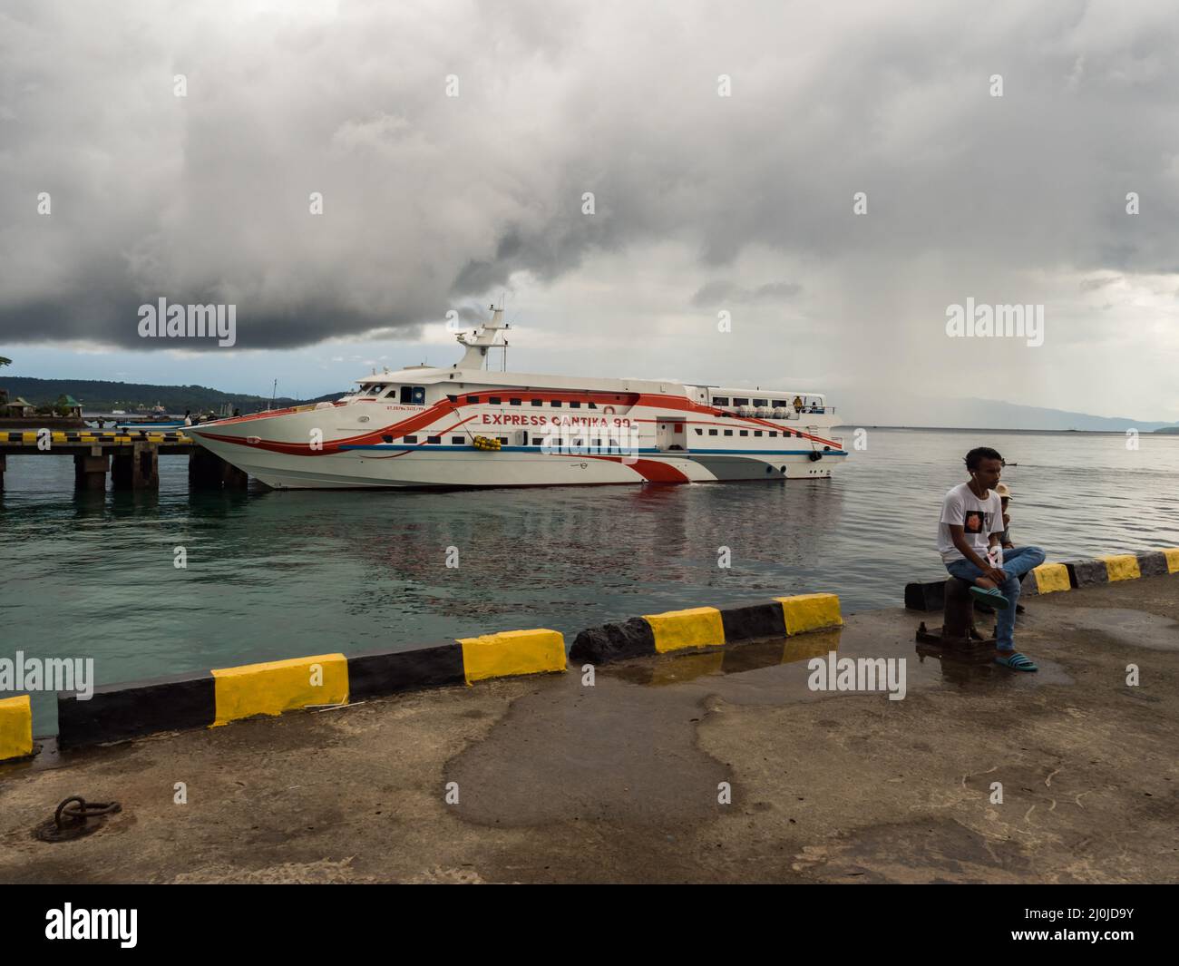 Ambon, Indonesia - February 15, 2018: A boat floating between the ...
