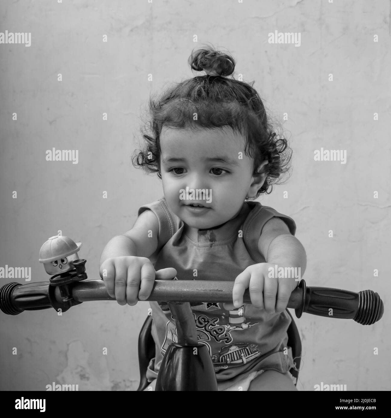 Cute little boy Shivaay driving cycle at home balcony during summer ...