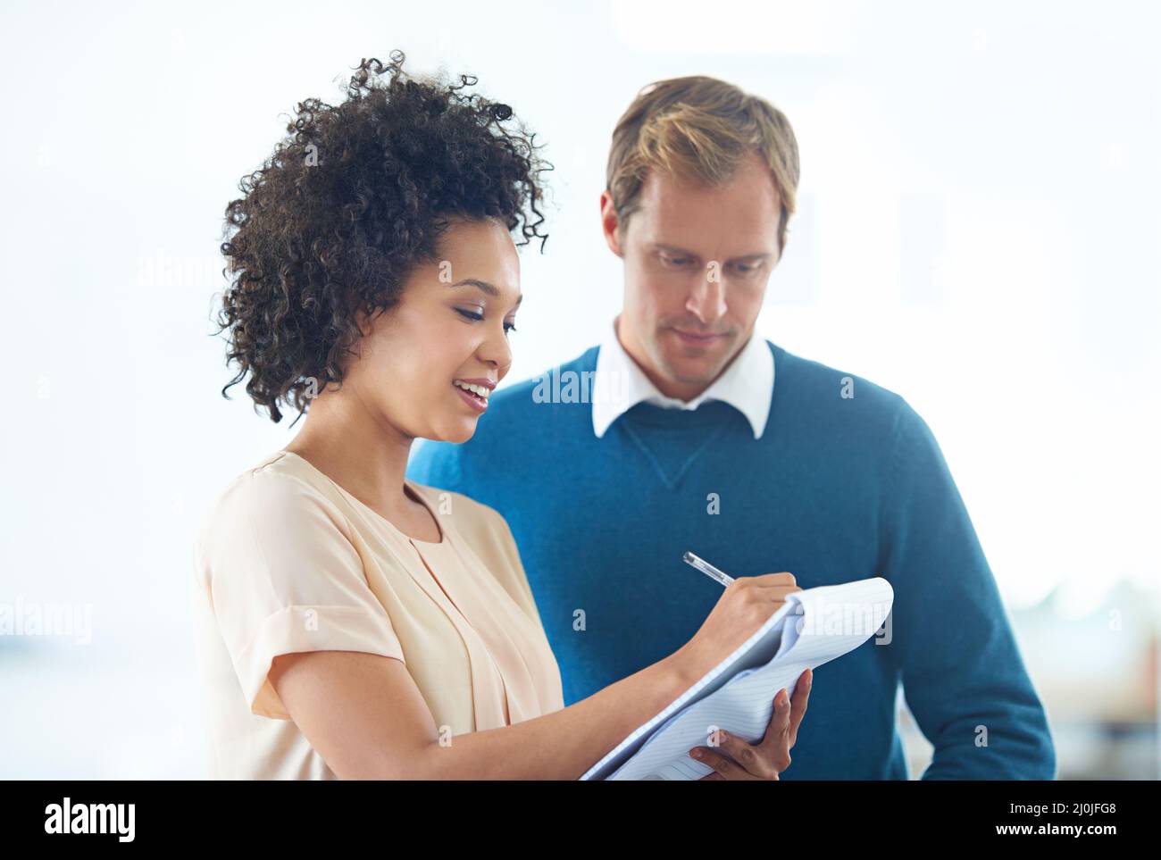 They have the best ideas. Shot of two business people discussing ideas ...
