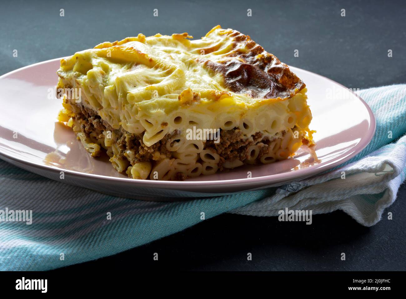 Piece of Greek lasagna with meat sauce and bechamel, known as pastitsio ...