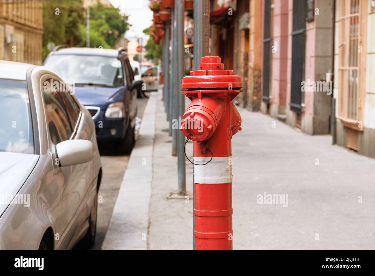 Red fire hydrant in city street. Fire hidrant for emergency fire access ...