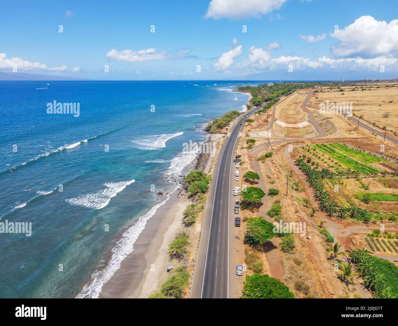 Aerial view of beach and ocean with waves in the island of Maui, Hawaii ...