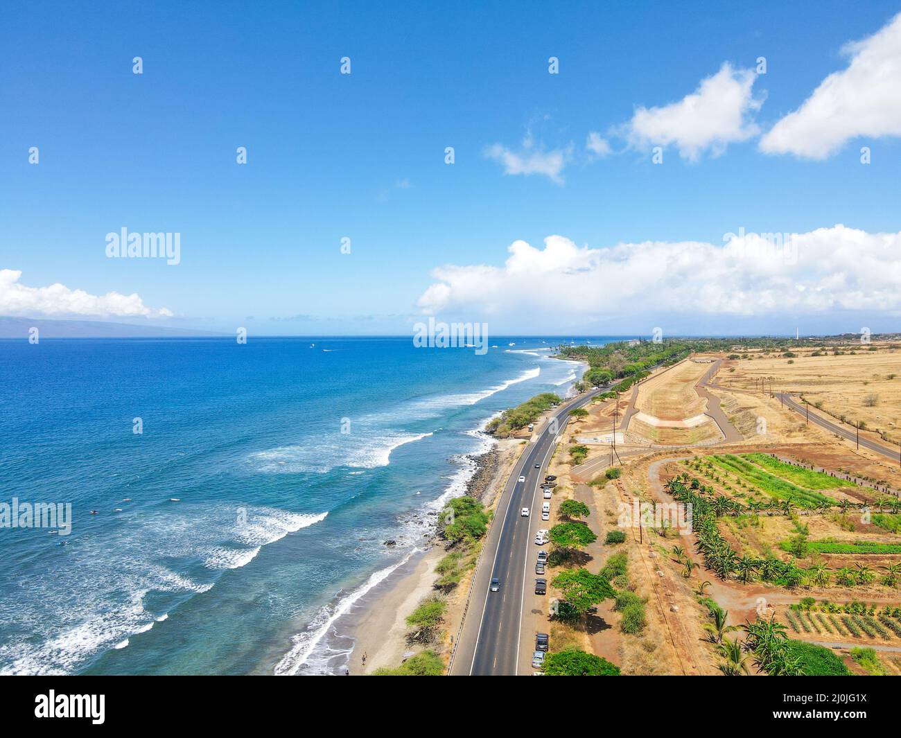 Aerial view of beach and ocean with waves in the island of Maui, Hawaii ...