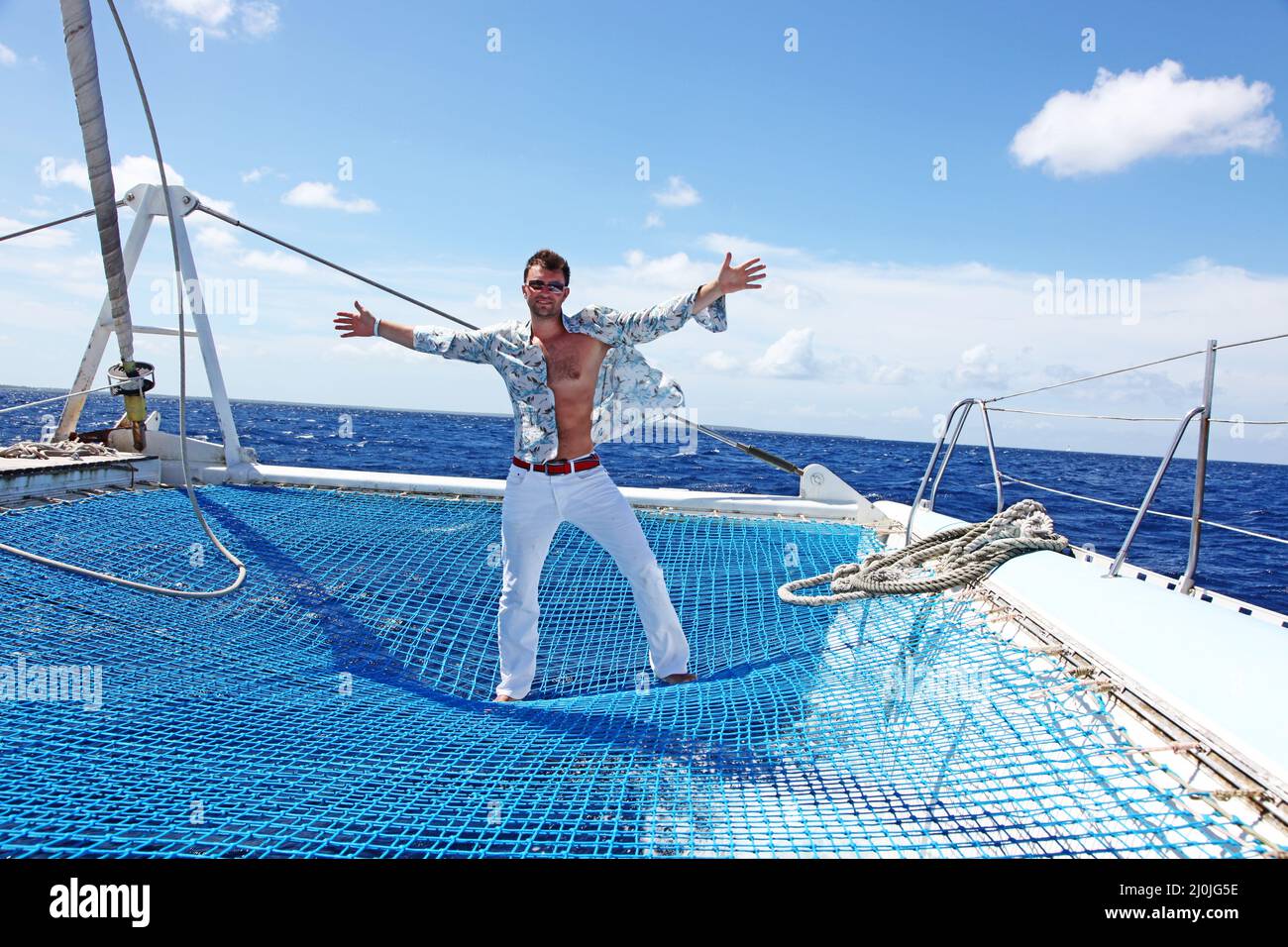 Young man on ship hi-res stock photography and images - Alamy