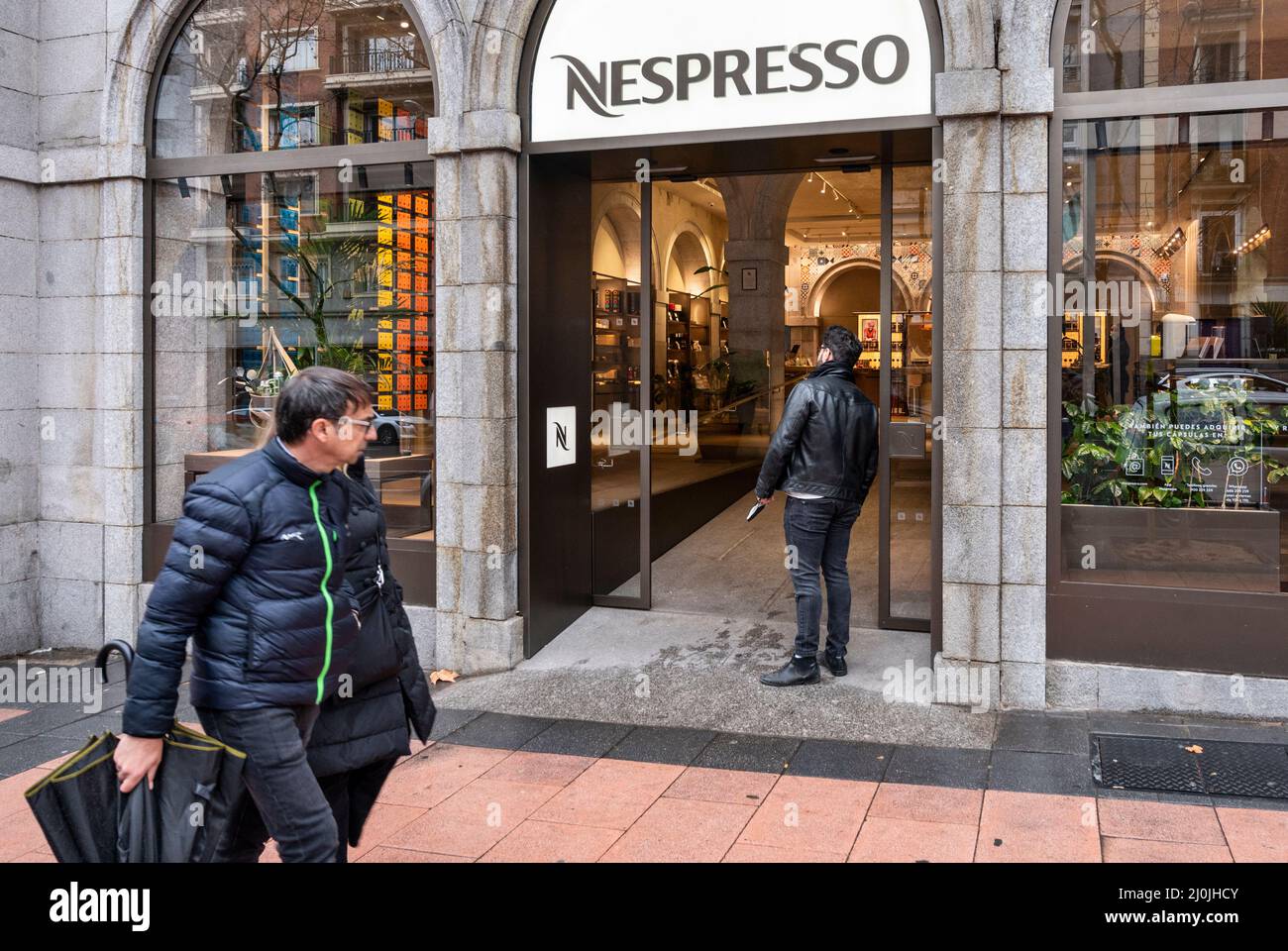 Pedestrians walk past the Swiss high-end and world leader in coffee ...