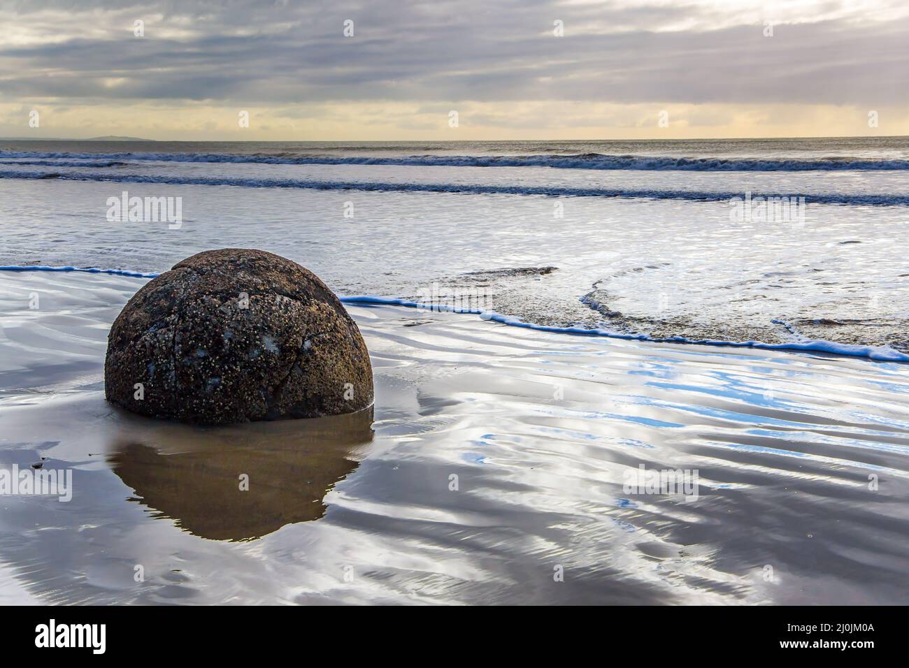 Moeraki's huge round boulder Stock Photo - Alamy
