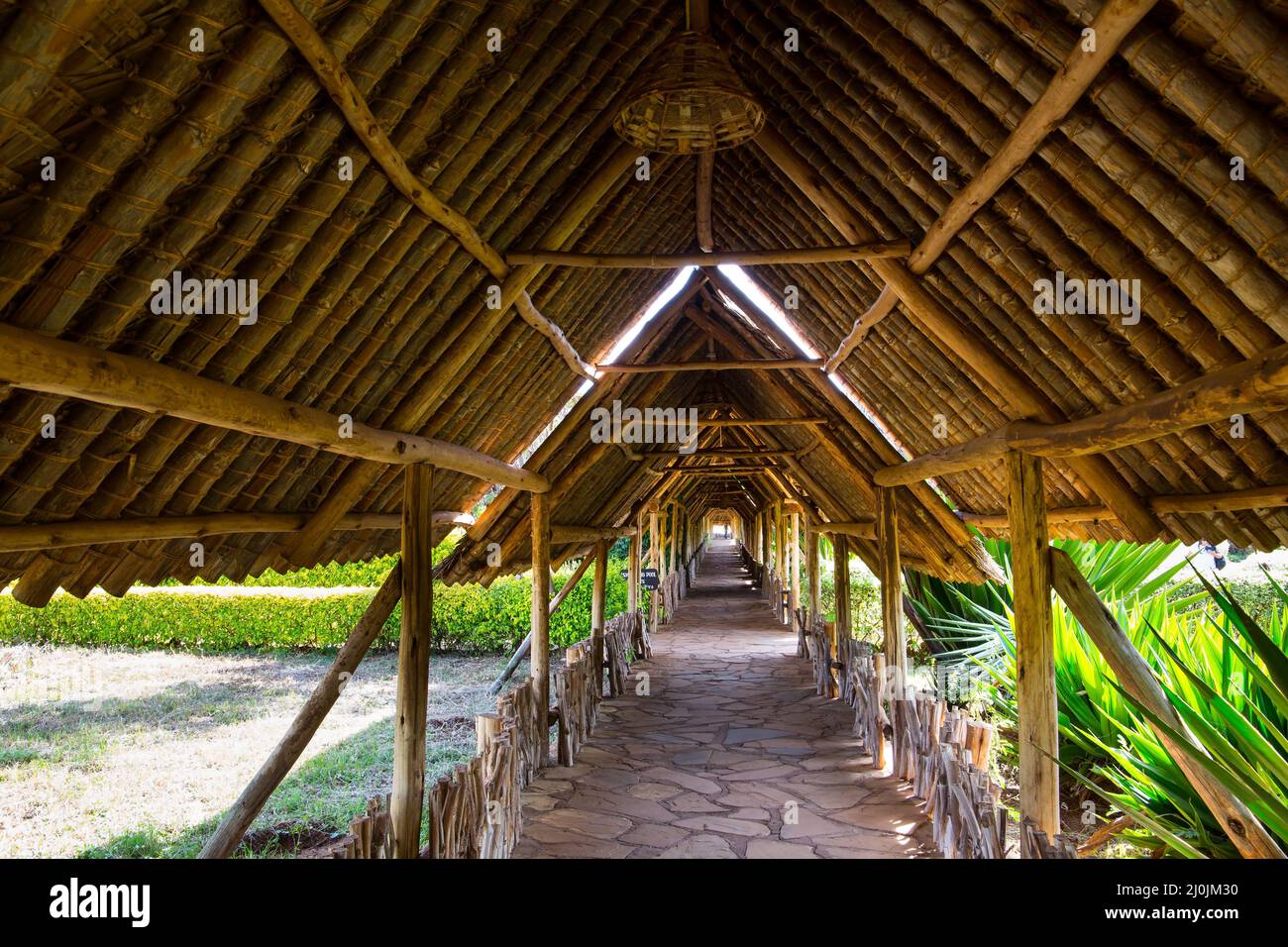 Bamboo covered walkway to tourist cottages Stock Photo - Alamy