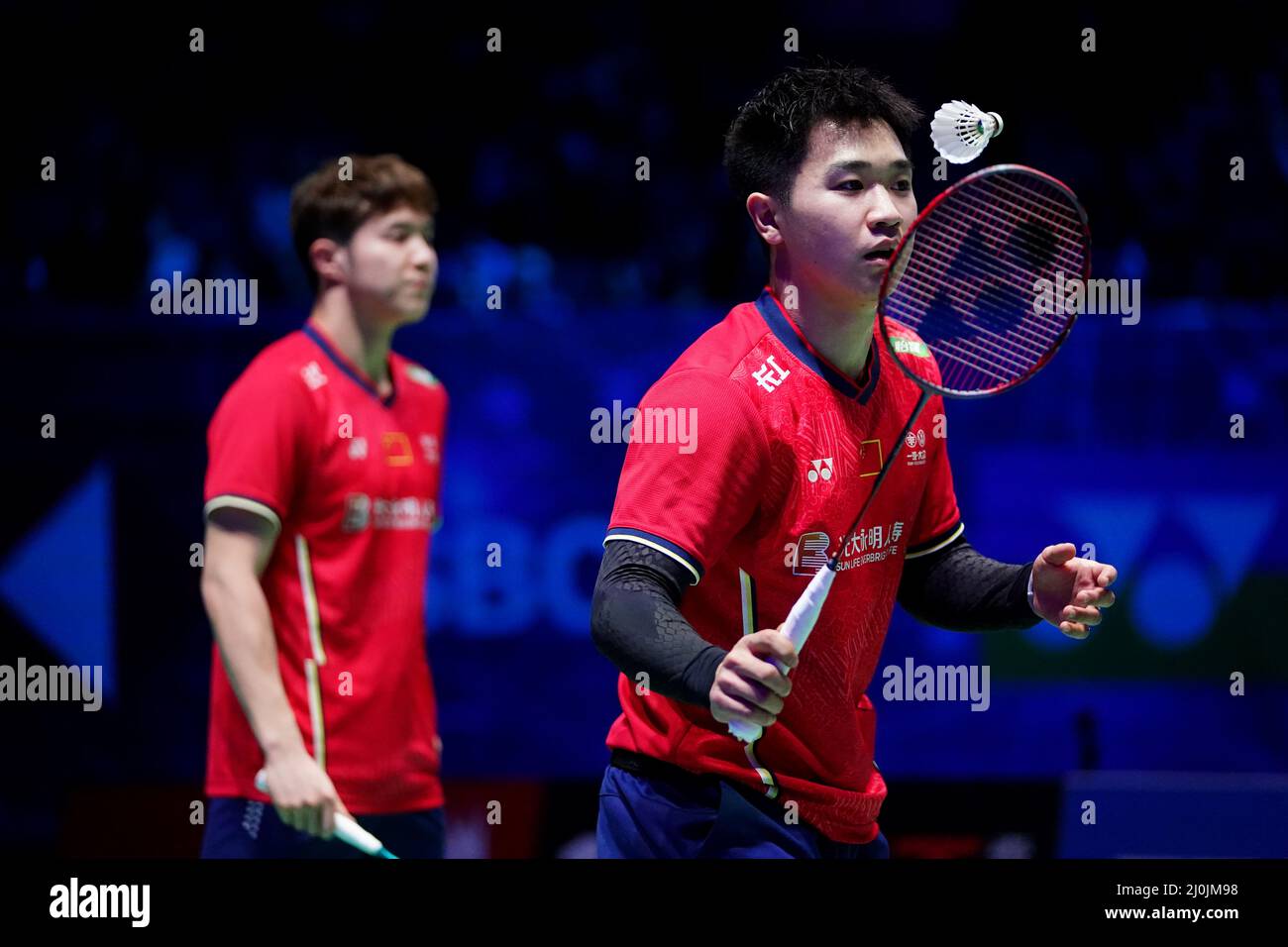 China's He Ji Ting and Tan Qiang (right) in action against Indonesia's ...